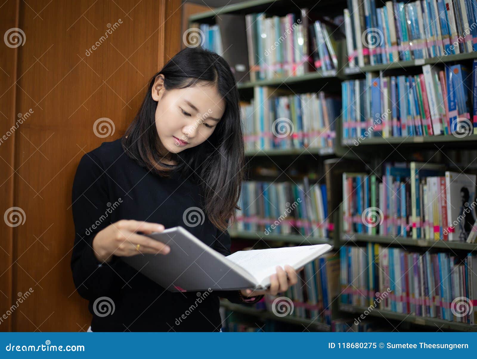 Asian Students Reading Books in the Library. Stock Image - Image of ...