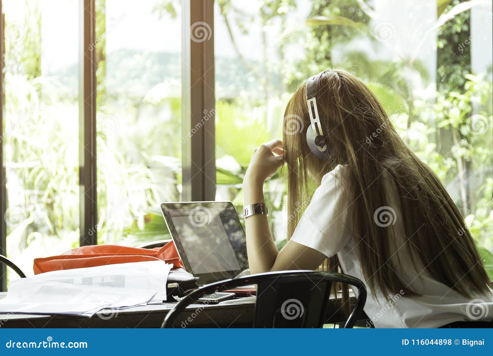 Asian Students in Uniform with Headphone Studying in Coffee Shop Stock ...