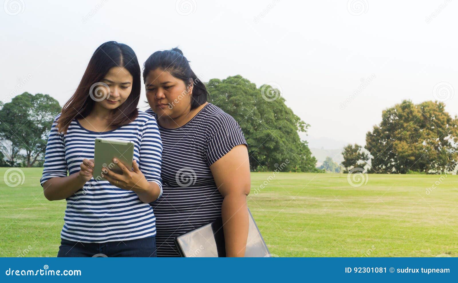 Asian Students are Using a Tablet To Check Their Grades. Stock Image ...