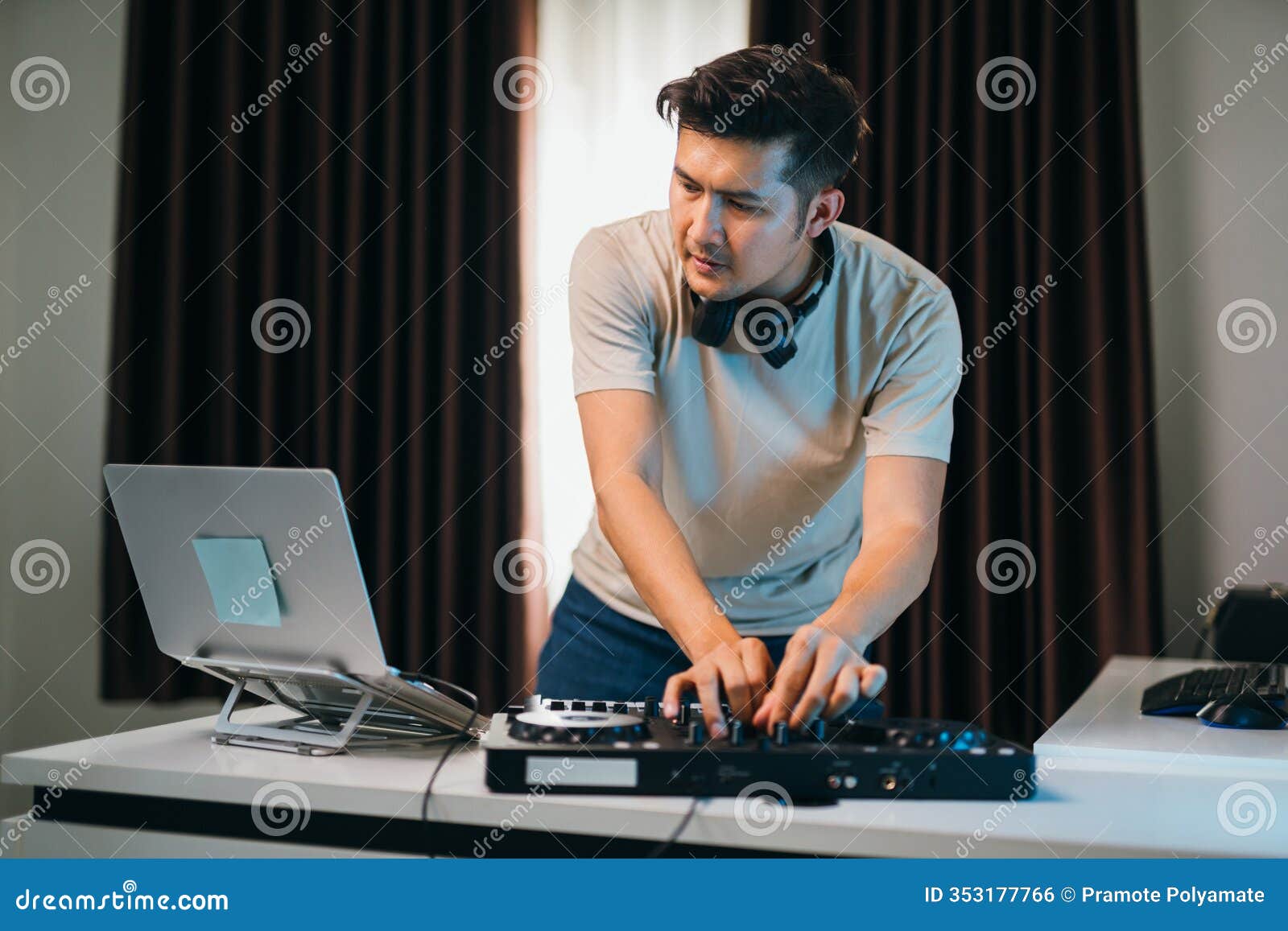 Asian Stylish DJ Setup at a Home Event, Featuring a Compact Mixer ...