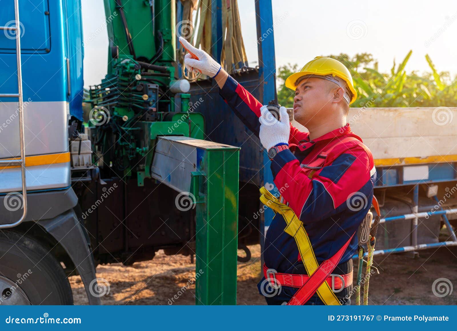 Asian Supervisor or Foreman is Using a Locator Radio for a Mobile Crane ...