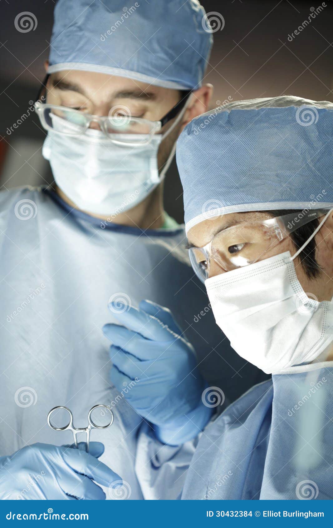 Asian Surgeon Working with Assistant in Surgery Stock Photo - Image of ...