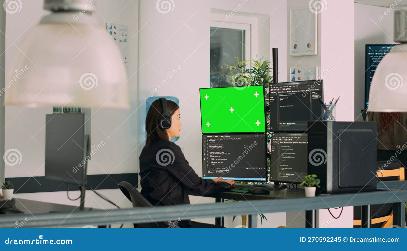 Asian System Engineer Programming App Code on Monitors with Greenscreen ...
