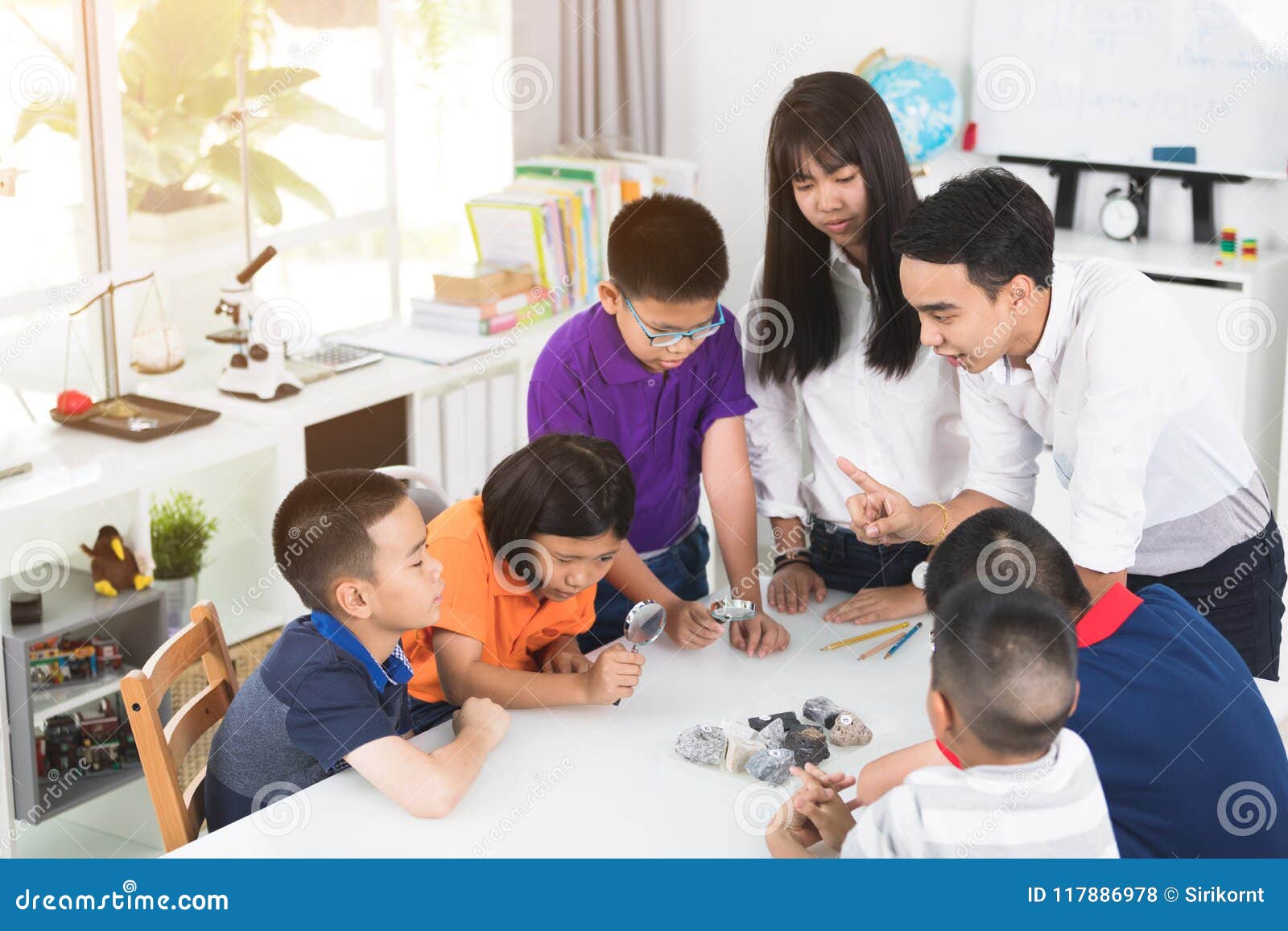 Asian Teacher Expanding To Student in Geology Class with Different of ...
