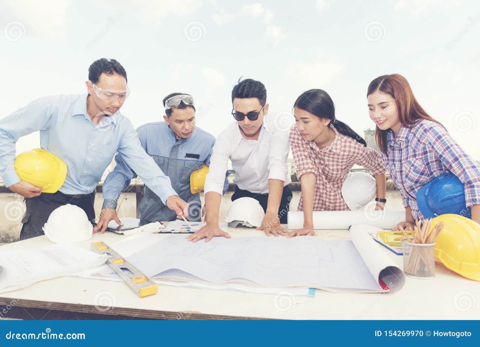 Asian Team Engineer Working in Construction Site. Construction Concept ...