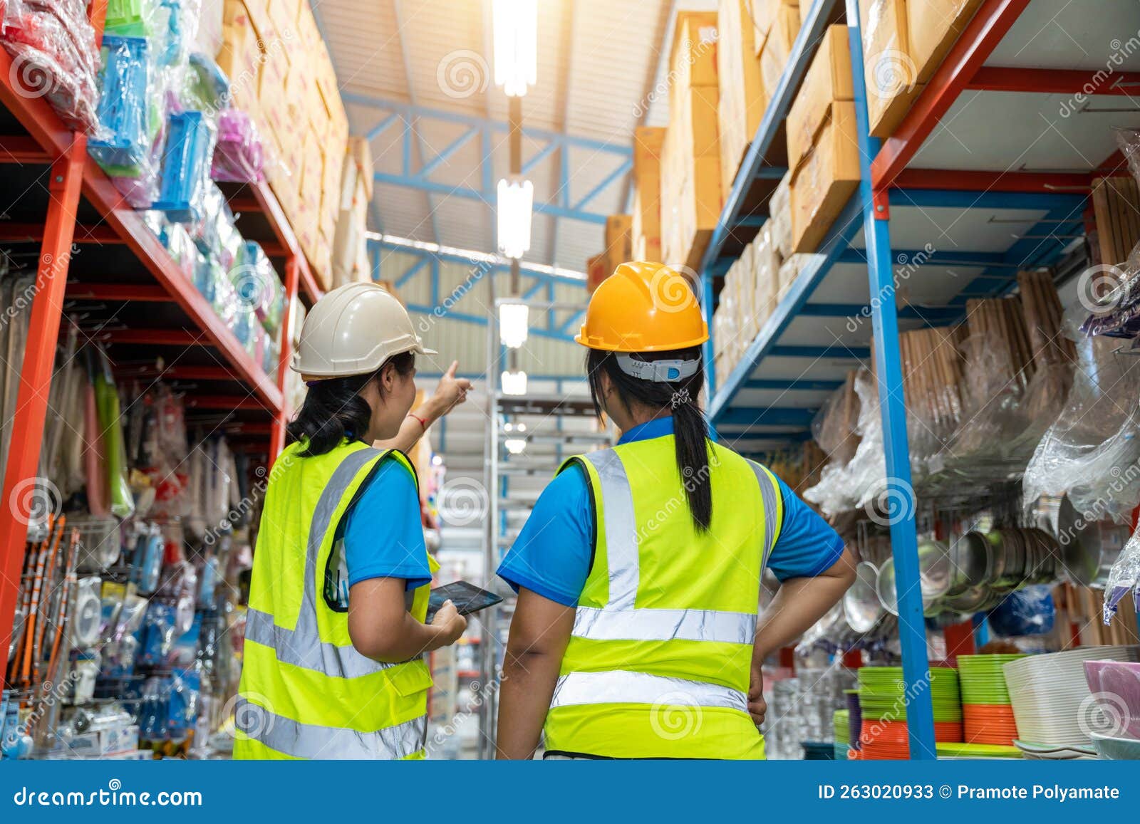 Asian Teamwork of Warehouse Workers Taking Package in the Shelf in a ...
