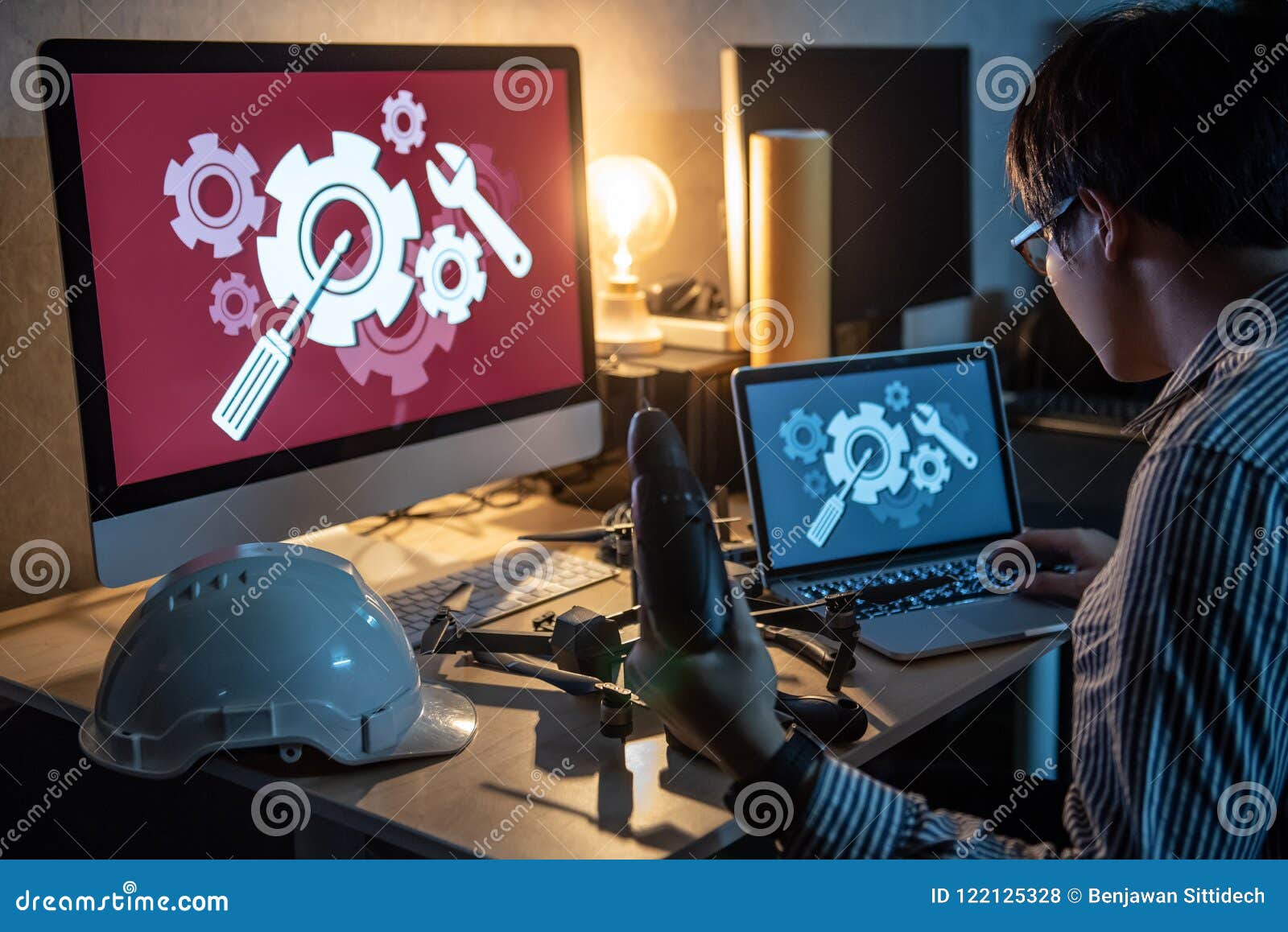 Asian Technical Engineer Using Screwdriver for Repairing Drone Stock ...