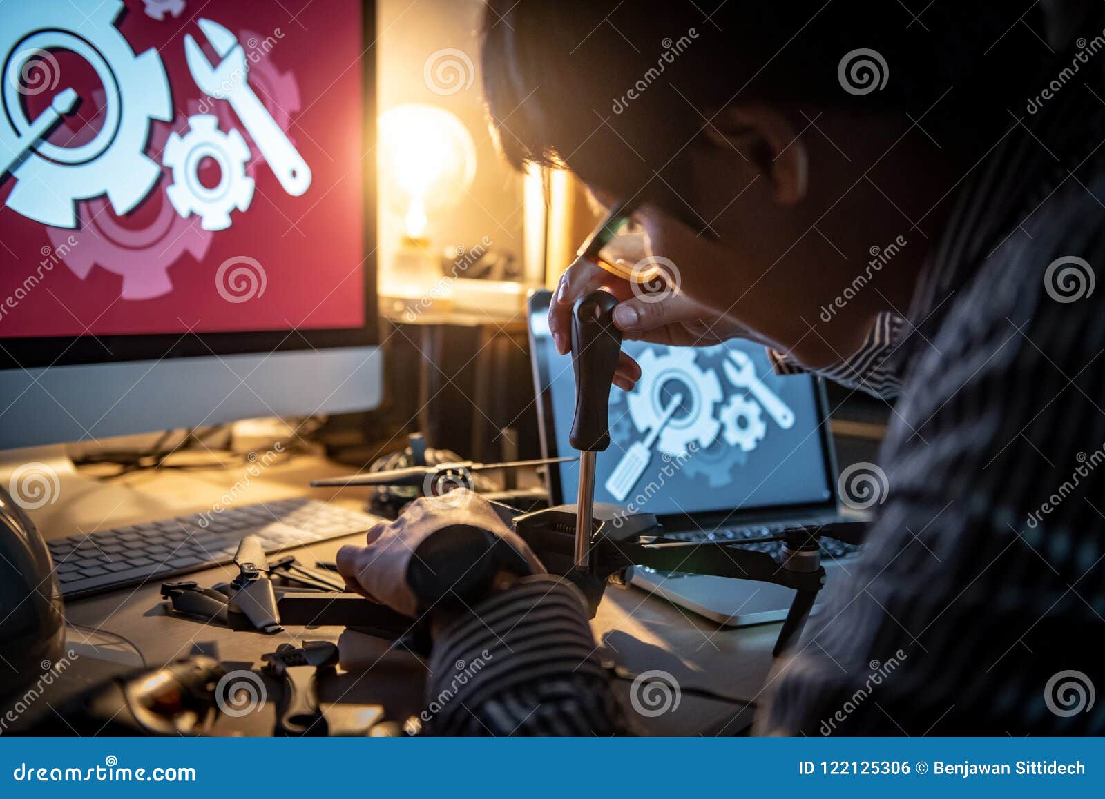 Asian Technical Engineer Using Screwdriver for Repairing Drone Stock ...