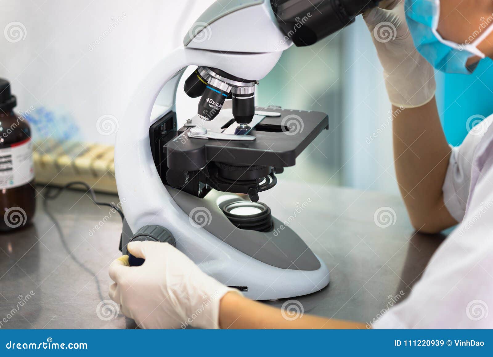 Asian Technician Tests the Quality of Product in Laboratory Closeup ...