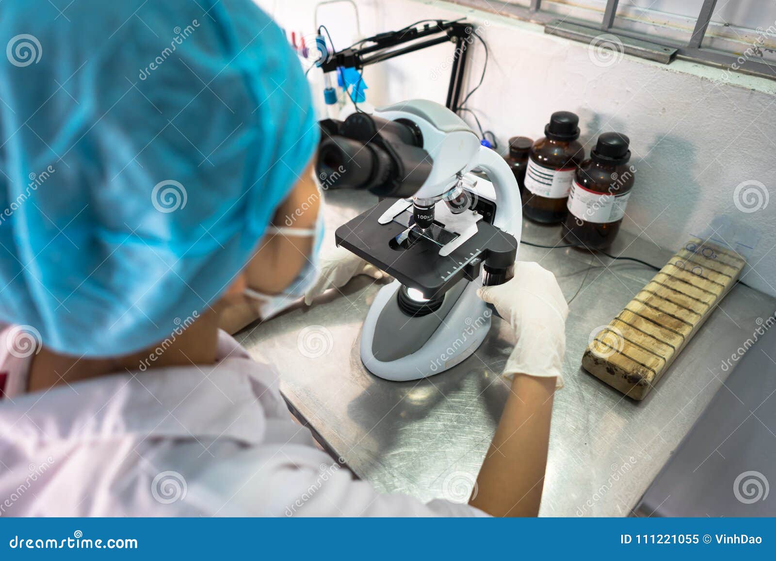 Asian Technician Tests the Quality of Product in Laboratory Closeup ... Asian Technician Tests the Quality of Product in Laboratory Closeup ...