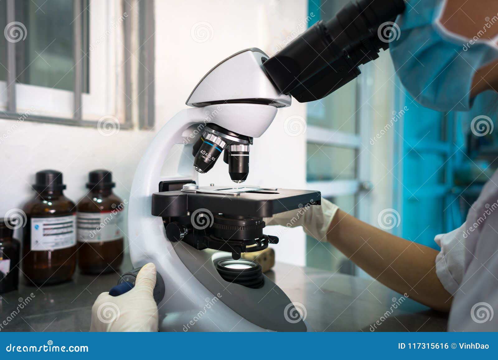 Asian Technician Tests the Quality of Product in Laboratory Closeup ...