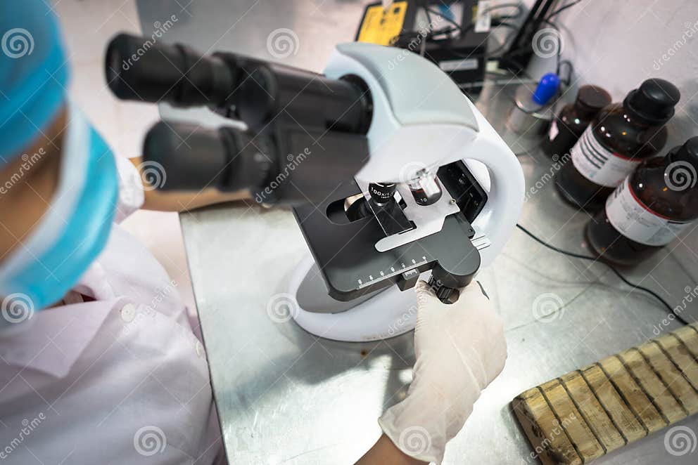 Asian Technician Tests the Quality of Product in Laboratory Closeup ... Asian Technician Tests the Quality of Product in Laboratory Closeup ...