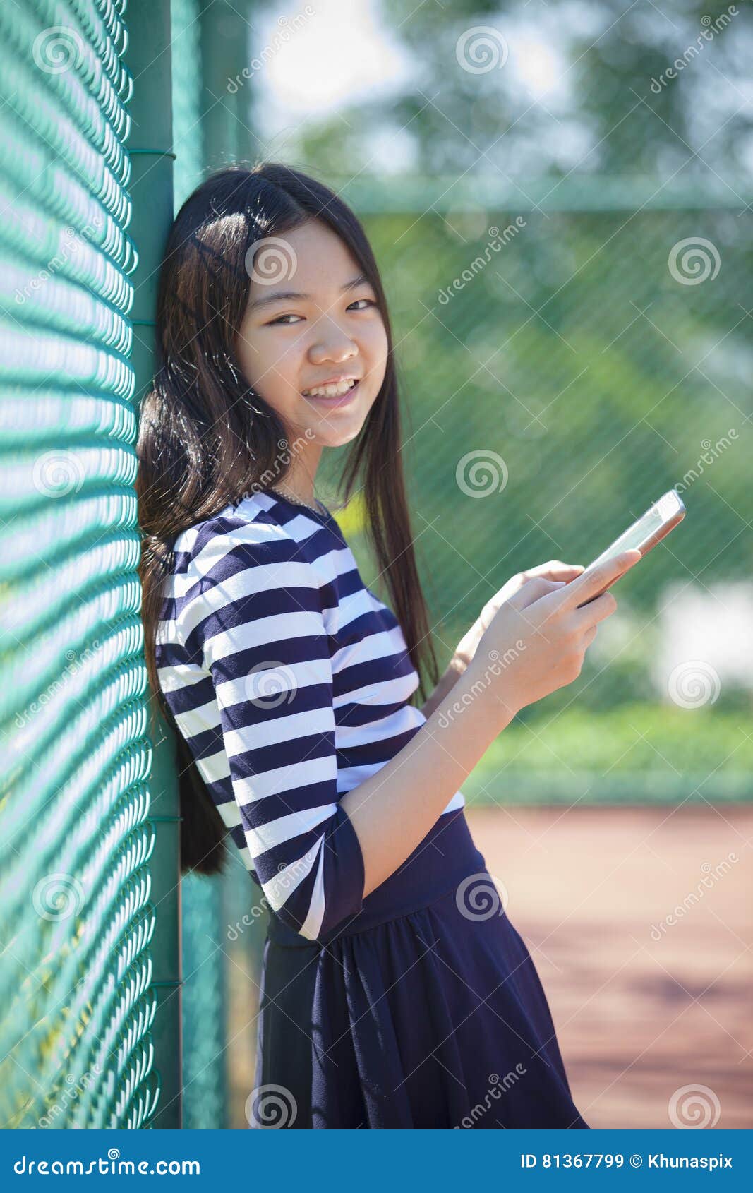 Asian Teen Age and Computer Tablet in Hand Stock Image - Image of hand ...