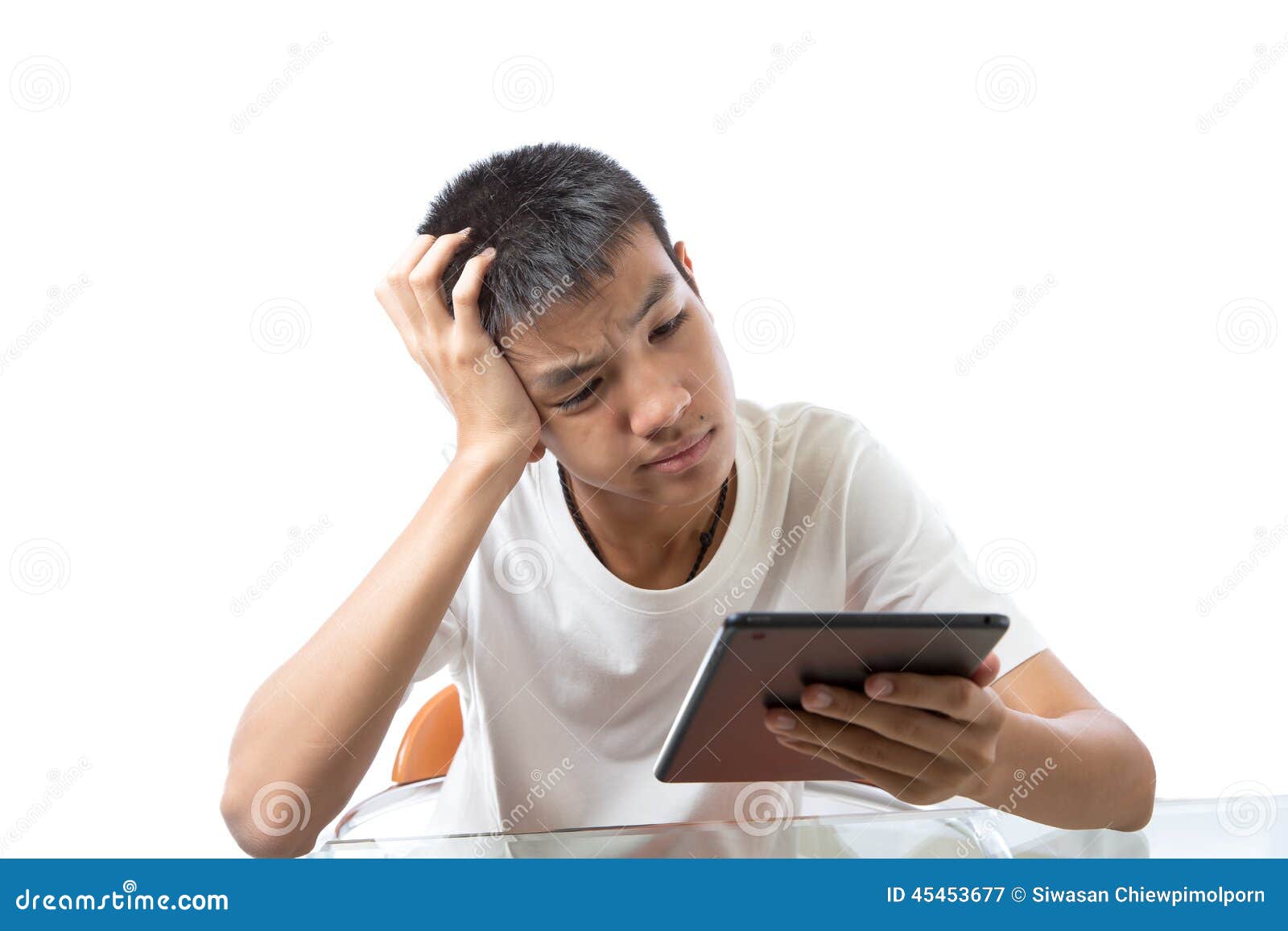 Asian Teenager Using His Tablet and Thinking Hard Stock Image - Image ...