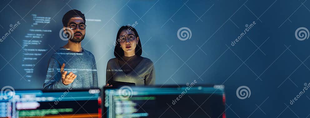 Asian Two Software Developers Engaged In Collaborative Coding Session