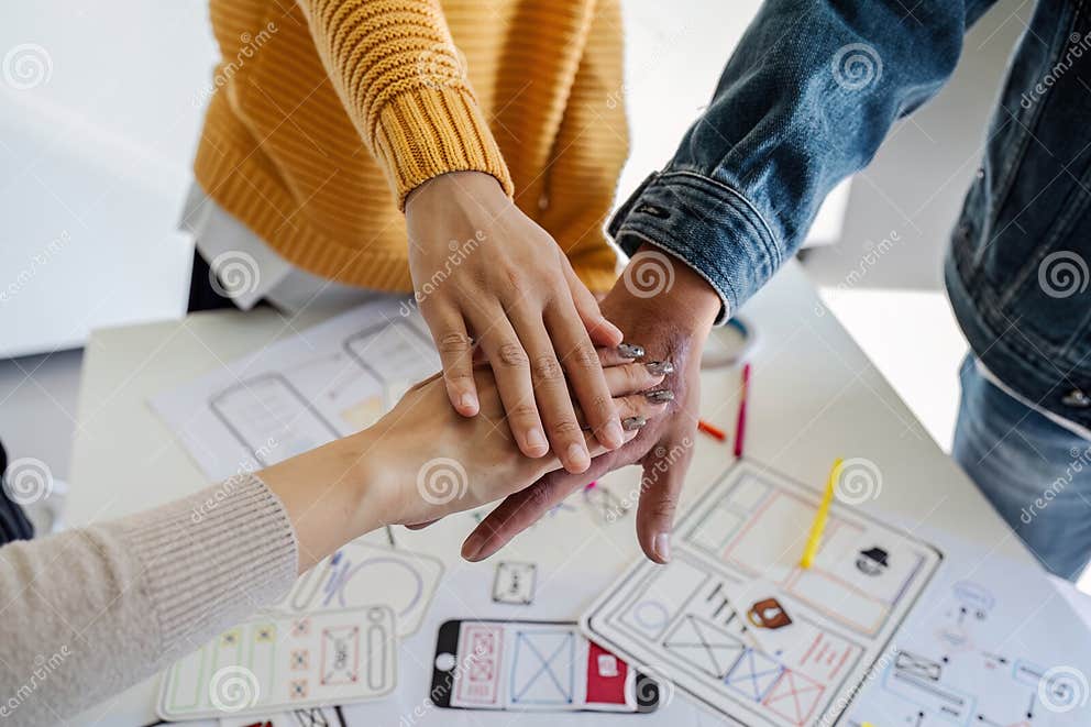 Asian Ux Developer and Ui Designer Team Stacking Hands Together ...