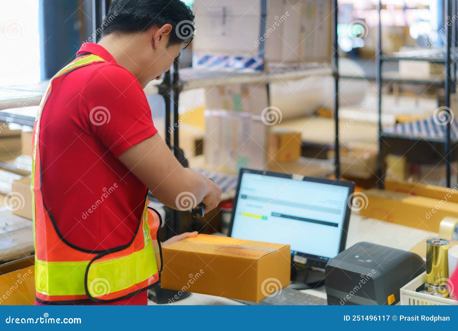 Asian Warehouse Man Worker With Computer And Barcode Scanner In ...