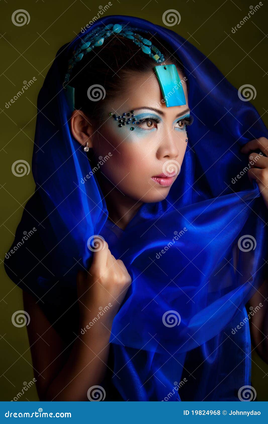 Asian woman in a blue veil stock photo. Image of portrait - 19824968