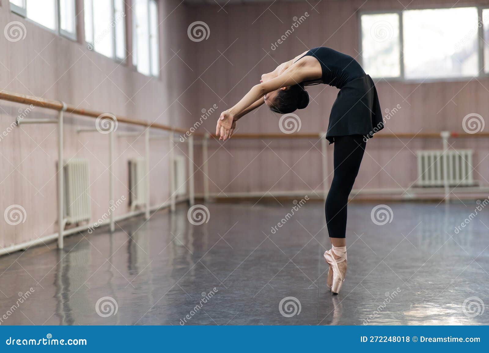 Asian Woman Dancing in Ballet Class. Bending in the Back. Stock Photo ...
