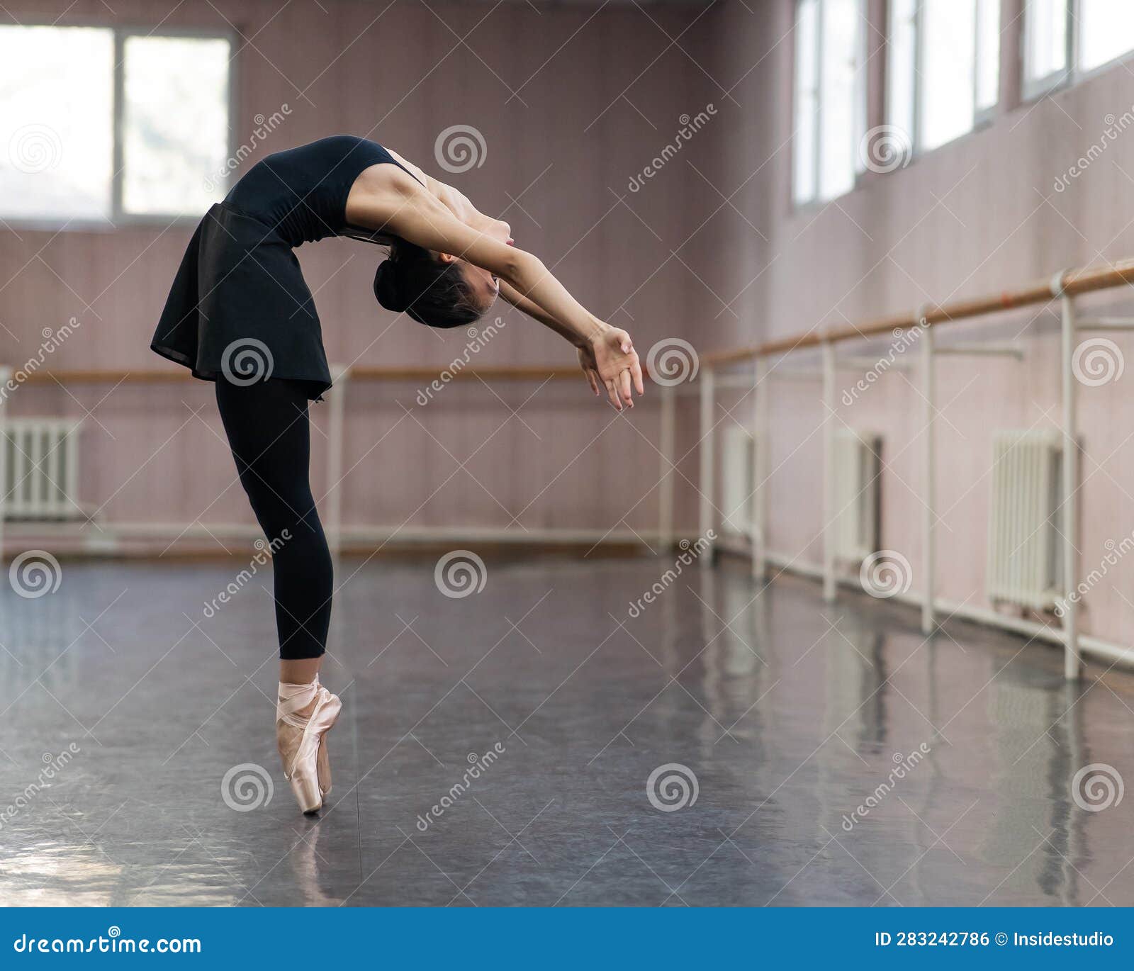 Asian Woman Dancing in Ballet Class. Bending in the Back. Stock Photo ...