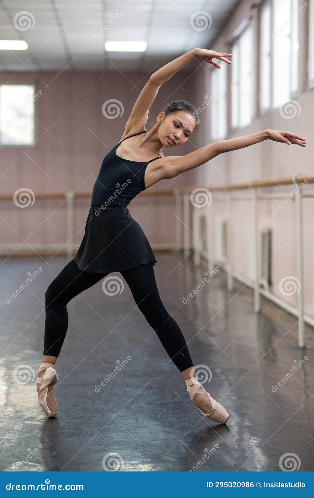 Asian Woman Dancing in Ballet Class. Bending in the Back. Stock Photo ...