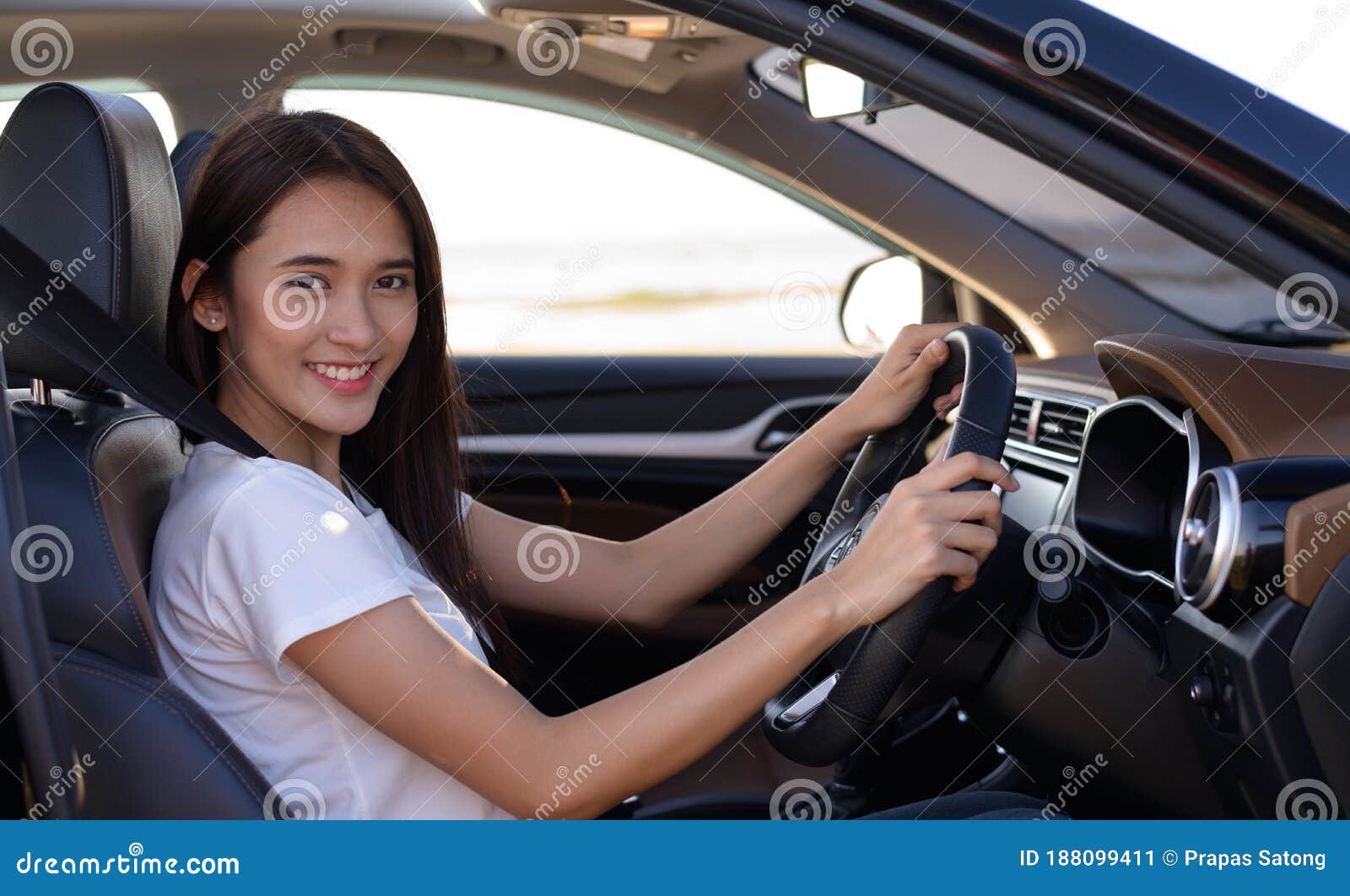 Asian woman driving a car stock image. Image of cute - 188099411