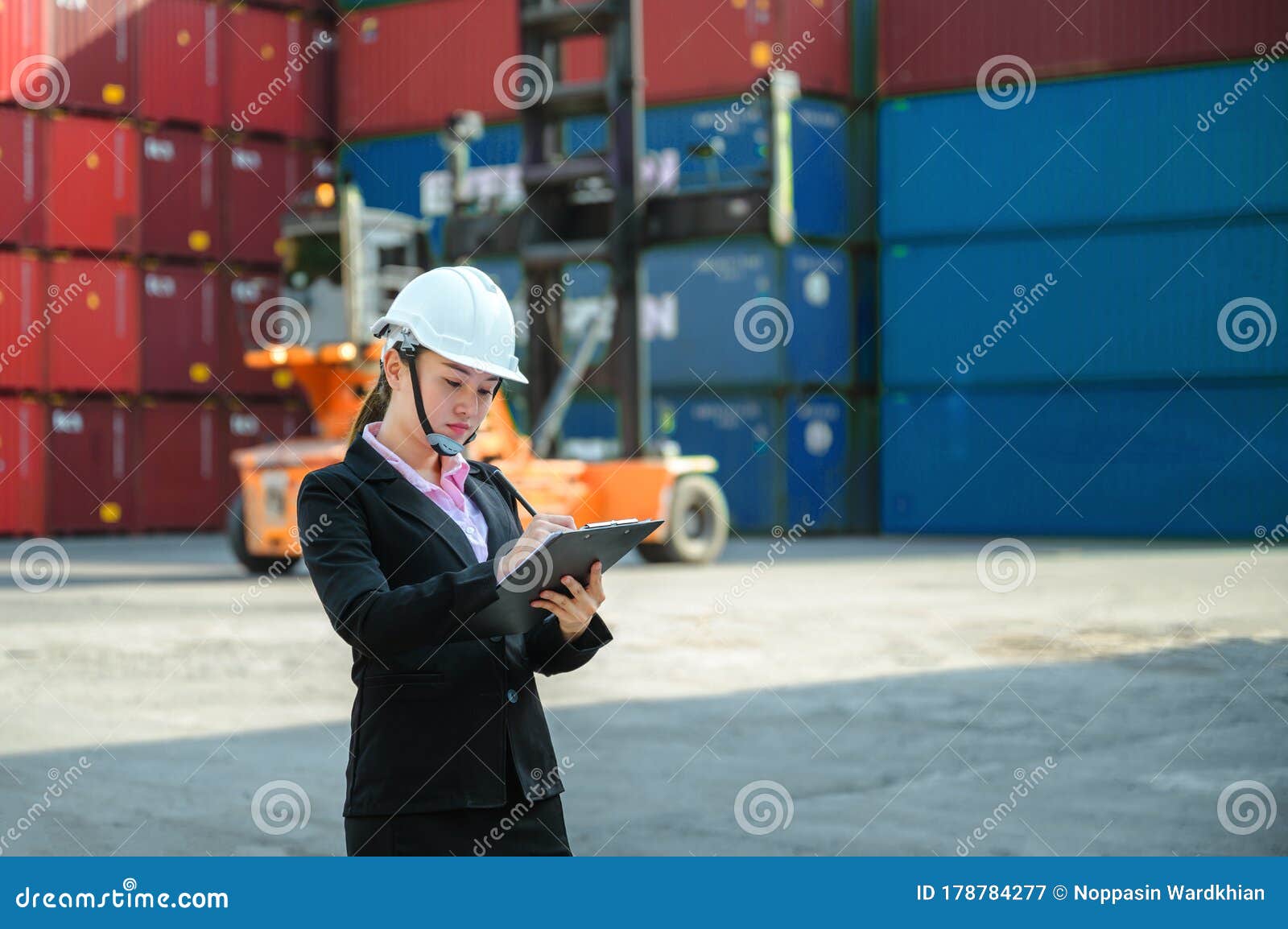 Asian Woman Engineer Use Check Sheet for Control Loading Containers Box ...