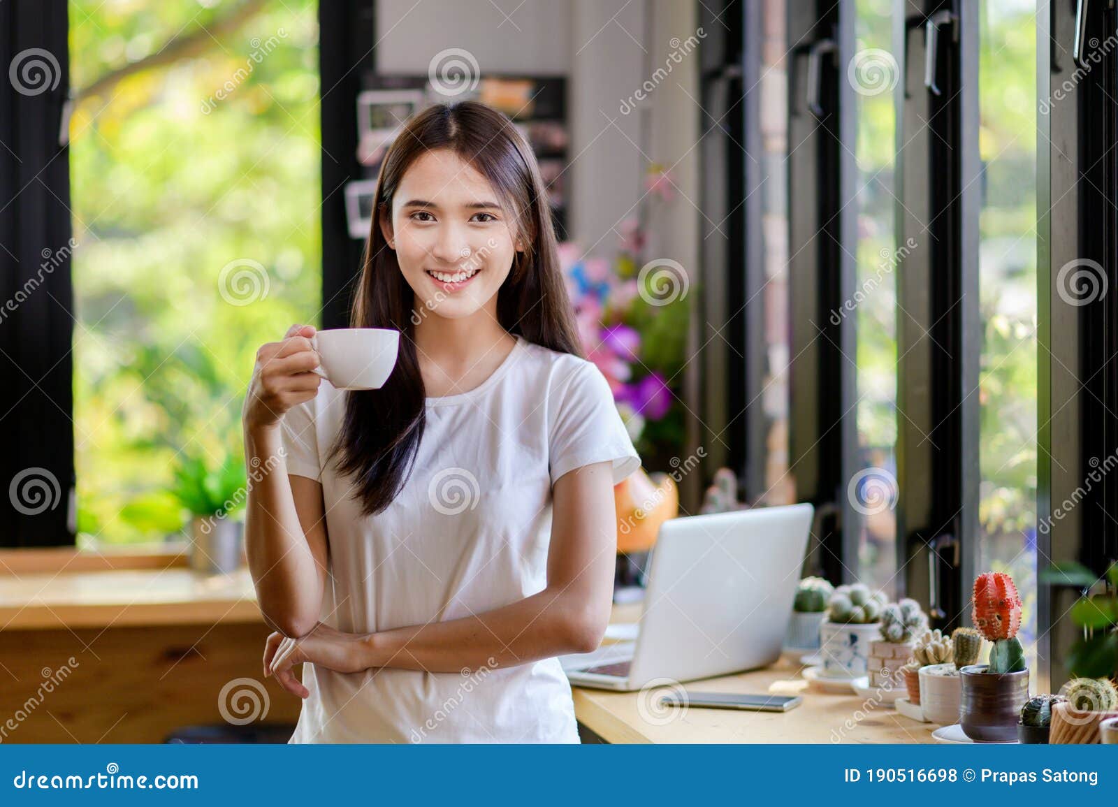Asian Woman or a Happy Student Smiles on a Desk with a Computer Stock ...