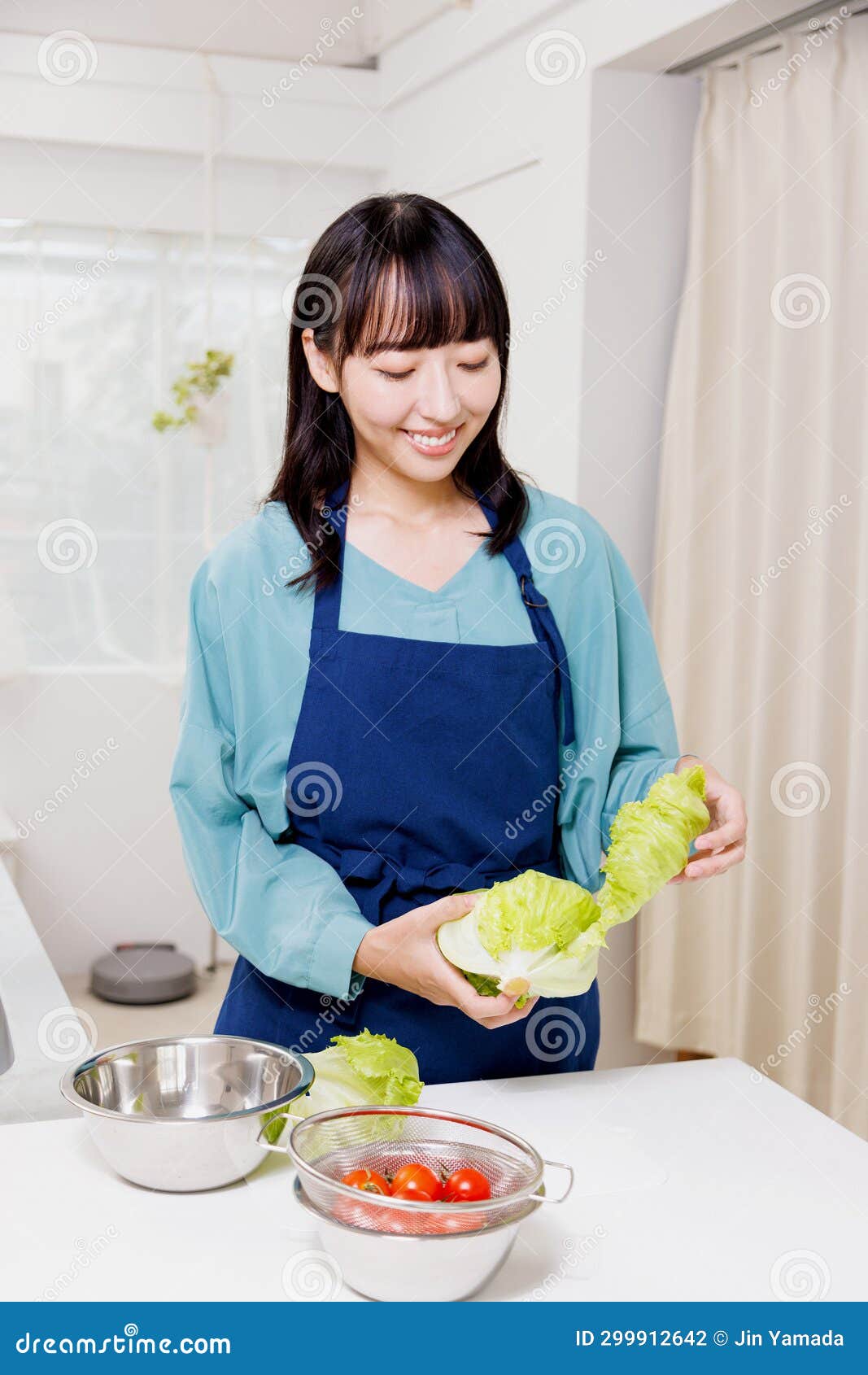 With Lettuce in the Kitchen Stock Photo - Image of medium, apron: 299912642