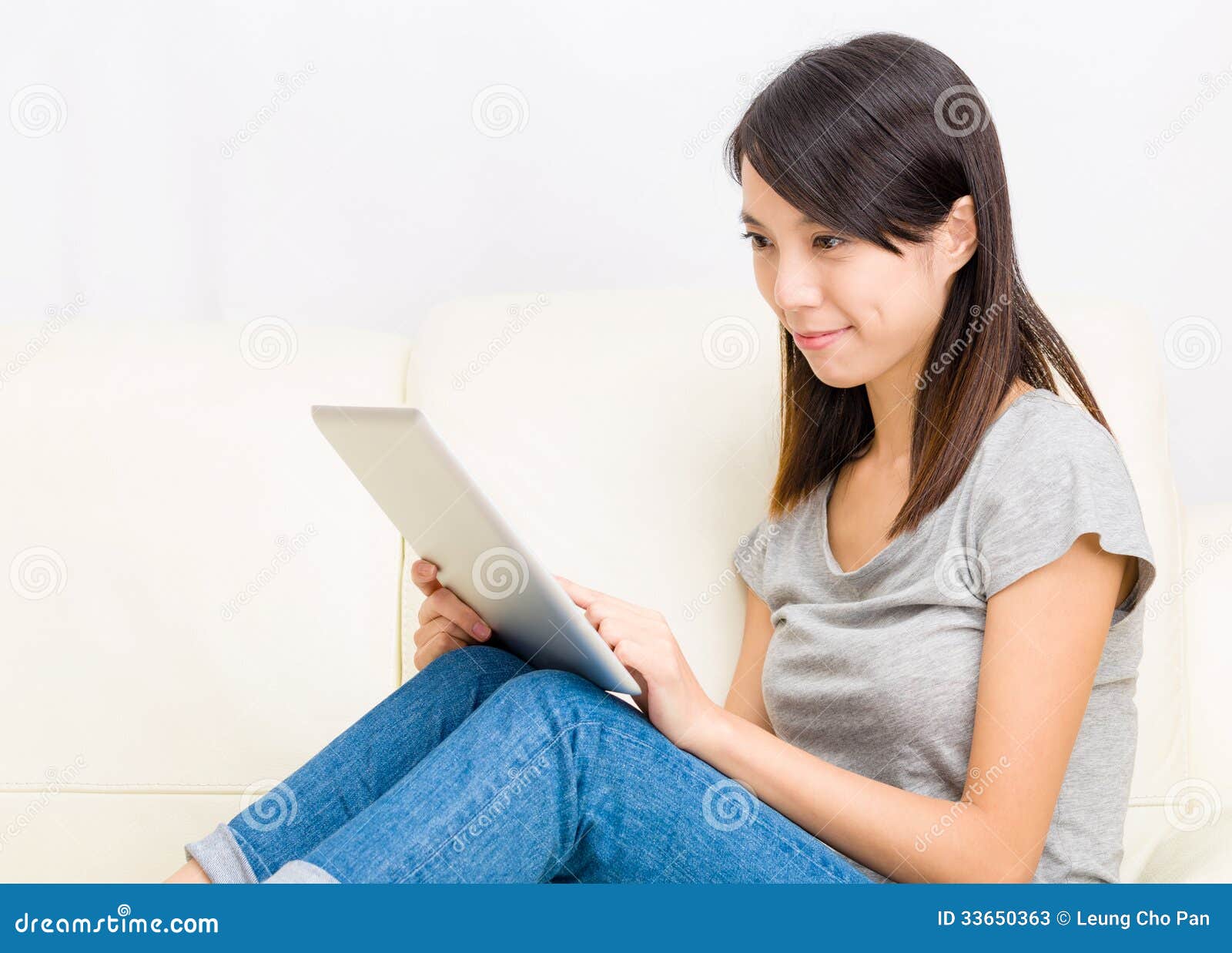 Asian Woman Looking at Tablet Stock Image - Image of white, hair: 33650363