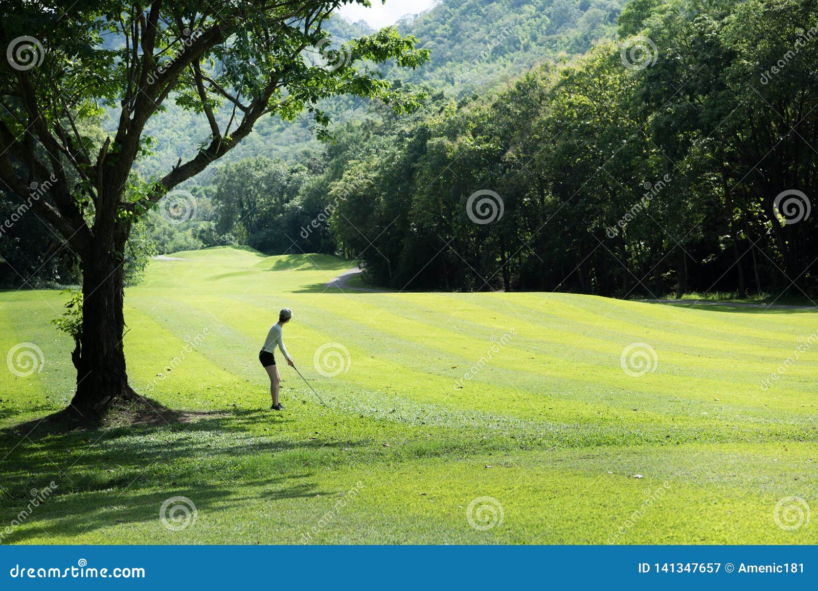 Asian Woman Playing Golf on a Beautiful Natural Golf Course Stock Image ...