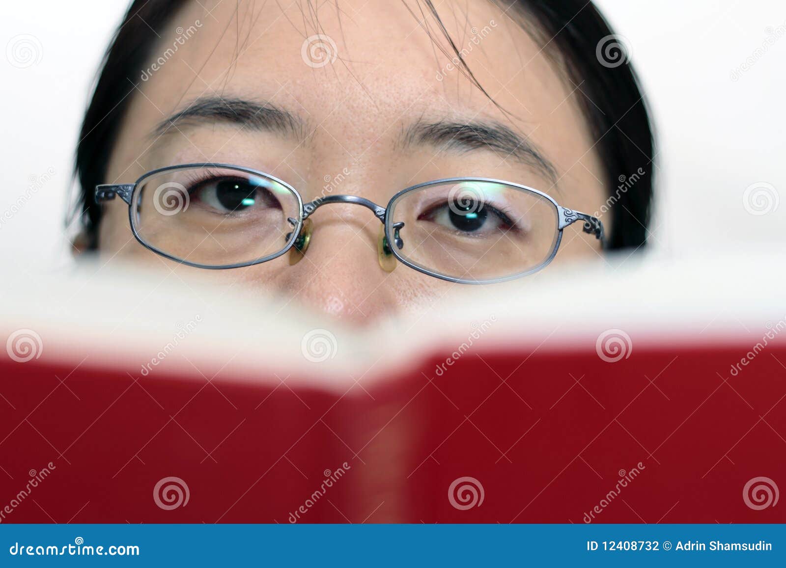 Asian woman reading a book stock photo. Image of indoors - 12408732