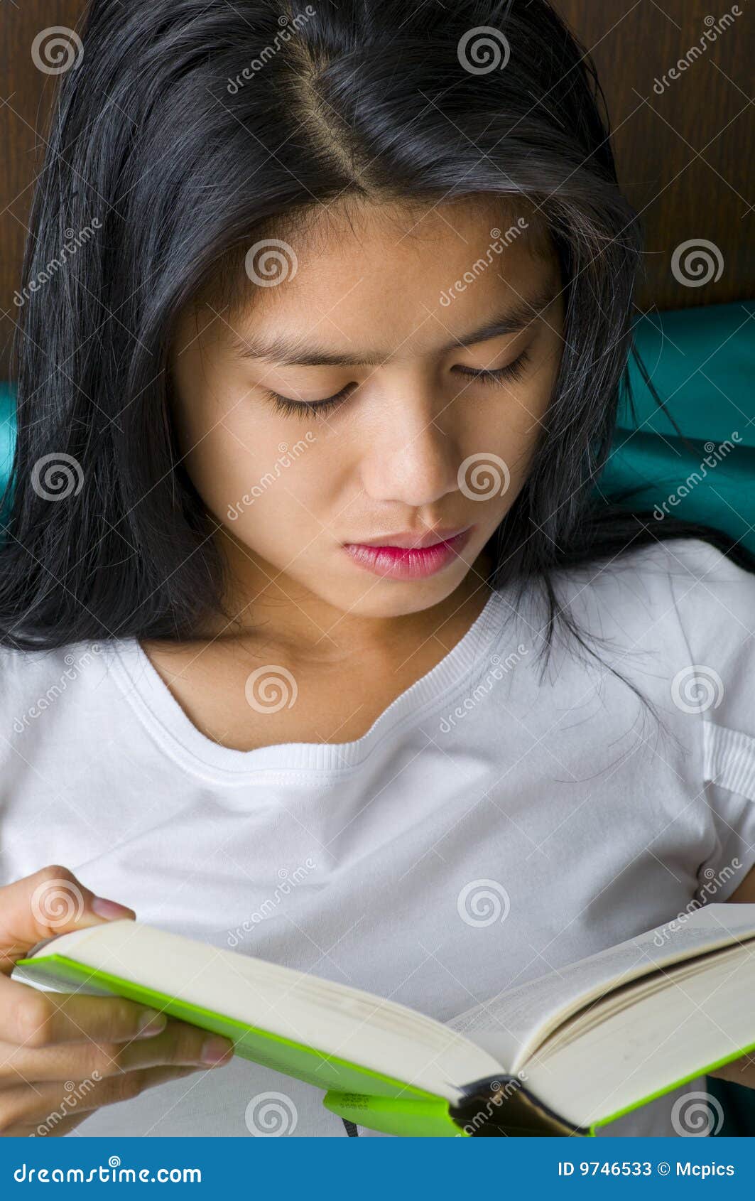 Asian woman reading a book stock image. Image of face - 9746533