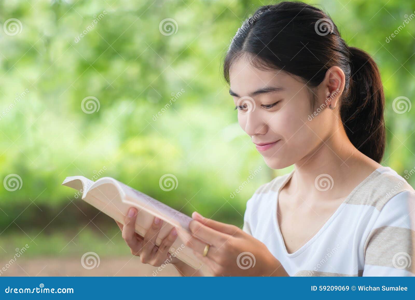 Asian woman reading book stock image. Image of outdoor - 59209069