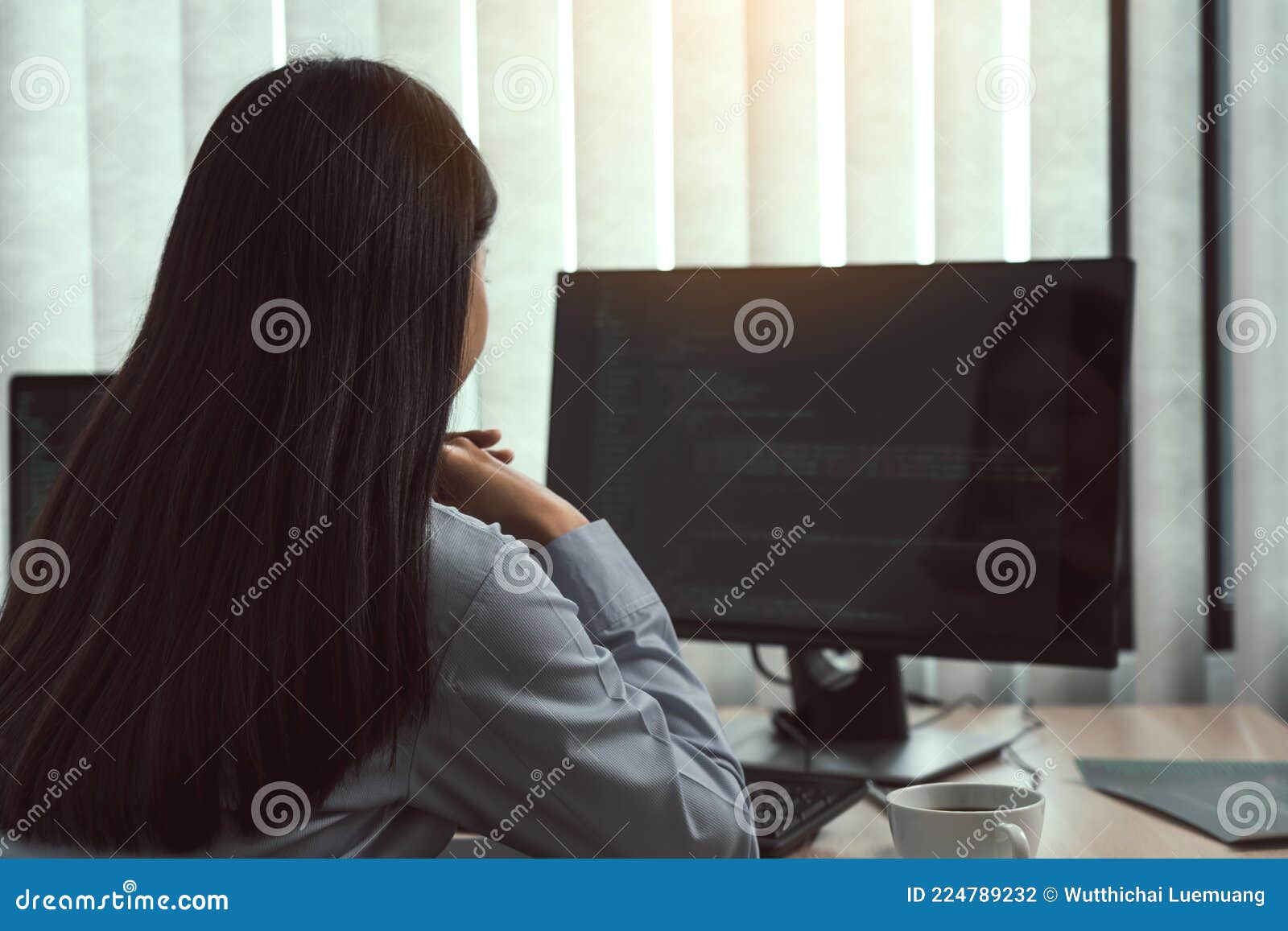 Asian Woman Software Developers Sitting in Front of Computers Looking ...