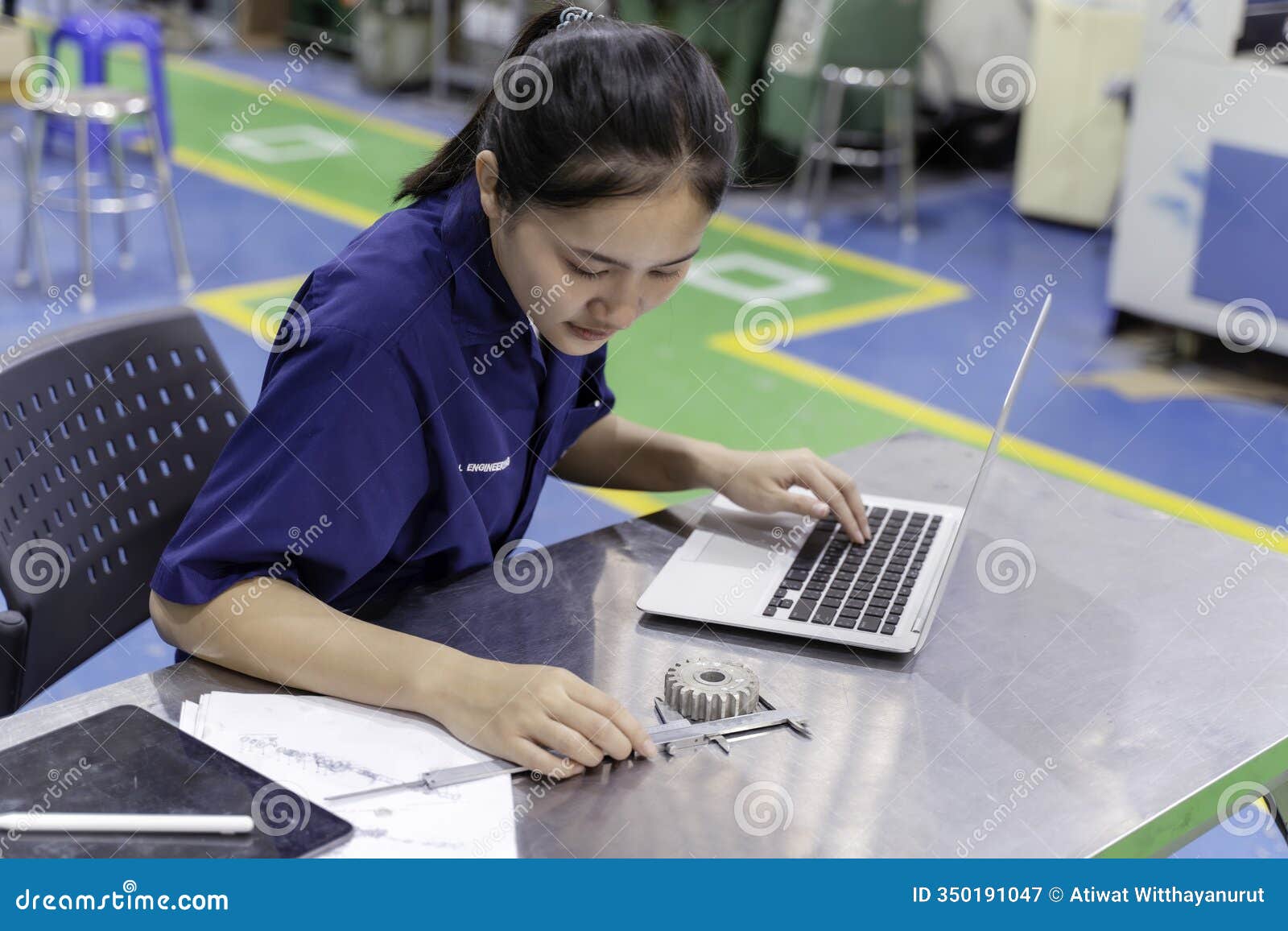 Asian Woman Technician Engineer Working Designing Mechanical Parts Engineering with Laptop and ...