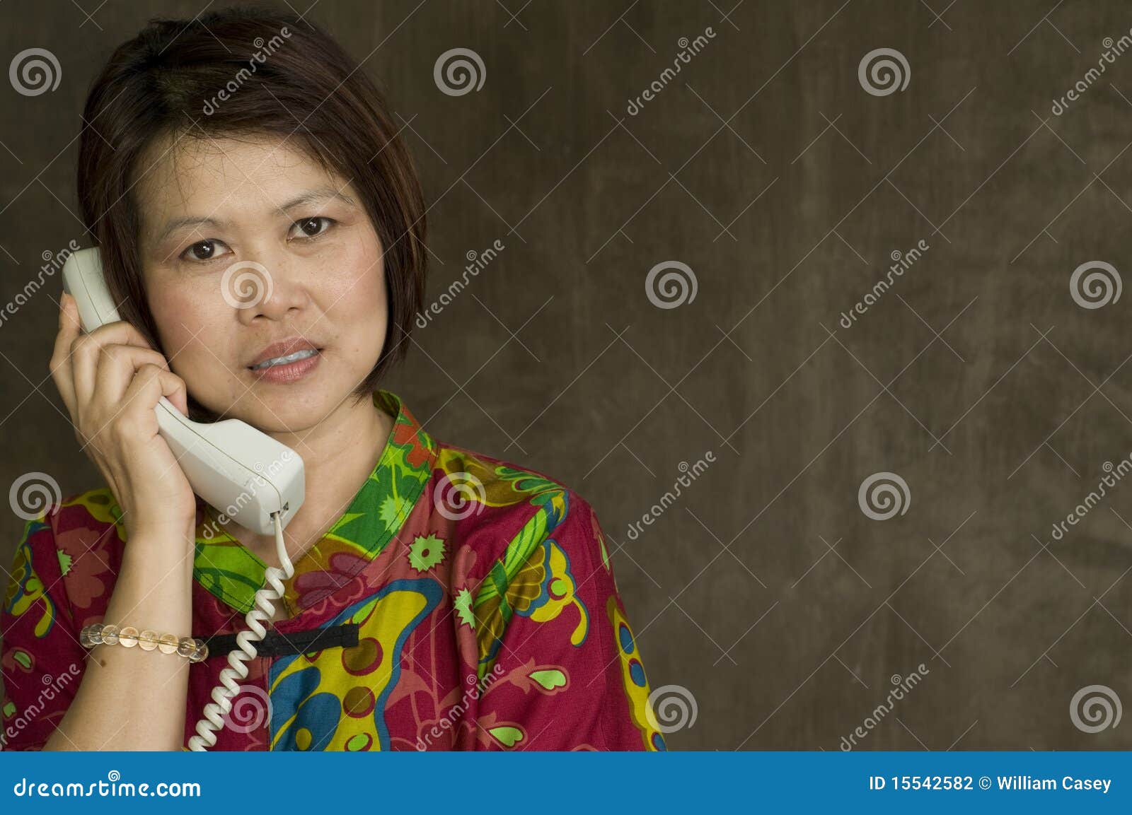 Asian woman with telephone stock photo. Image of smiling - 15542582