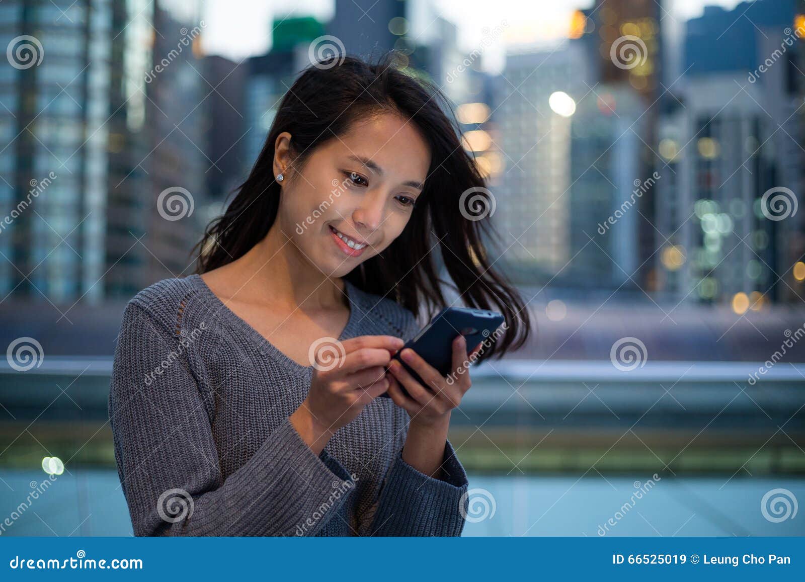 Asian Woman use phone stock image. Image of light, outdoor - 66525019