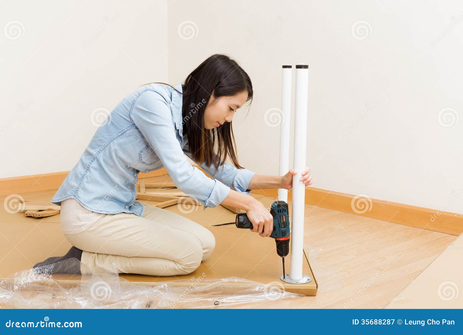Asian Woman Using Strew Driver for Assembling Furniture Stock Image ...