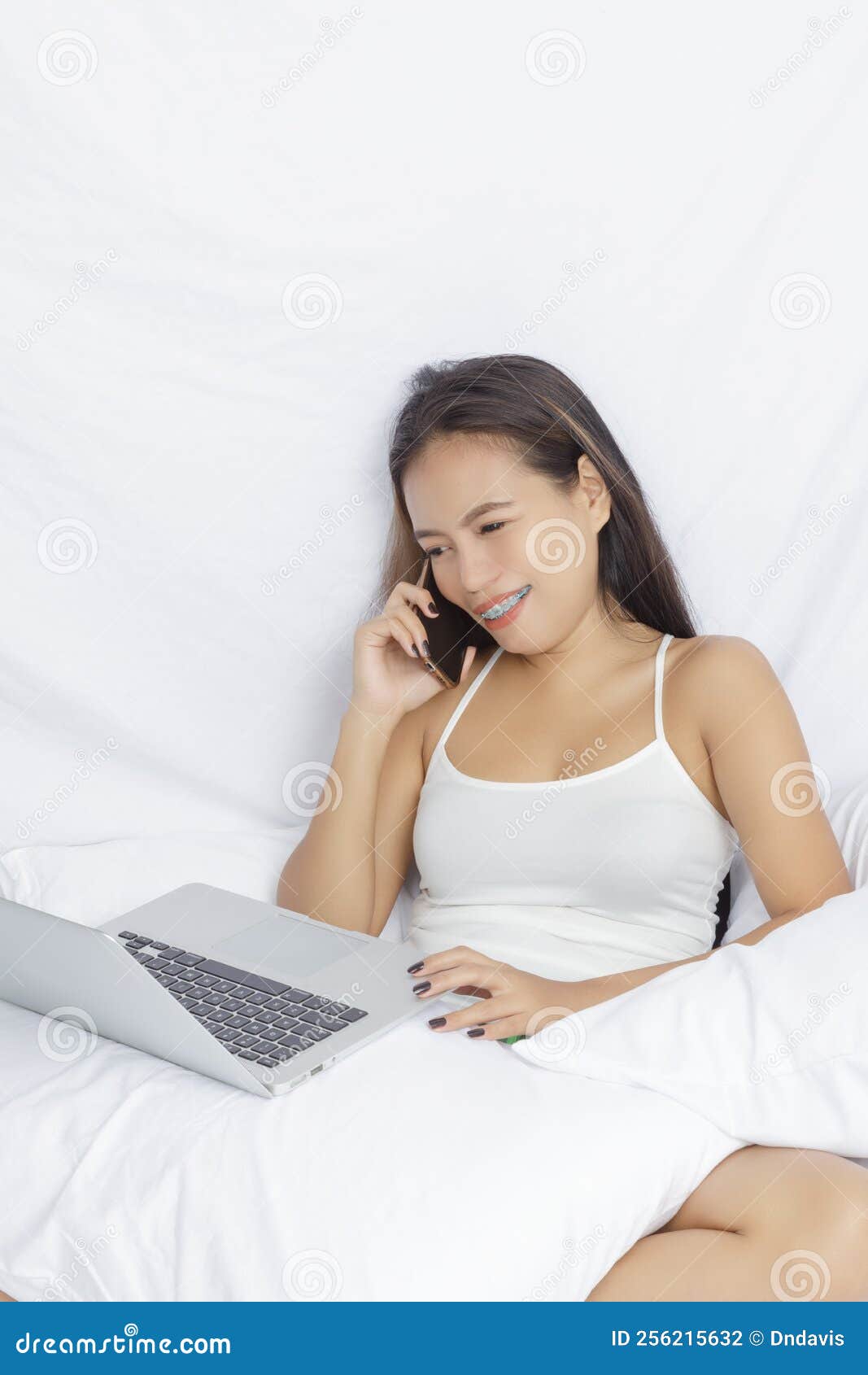 Asian Woman Working on a Computer in Bed Stock Photo - Image of asian ...