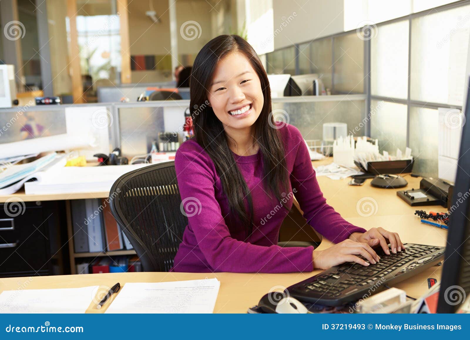 Asian Woman Working at Computer in Modern Office Stock Image - Image of ...
