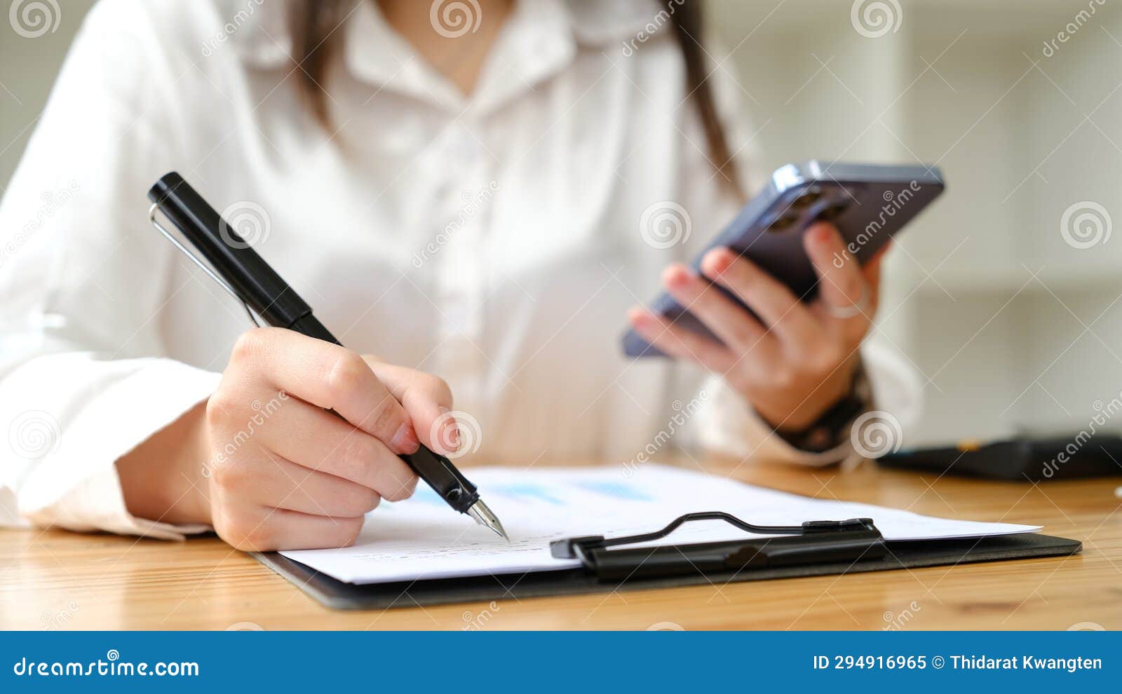 Asian Woman Writing and Using Smart Phone Stock Image - Image of ...