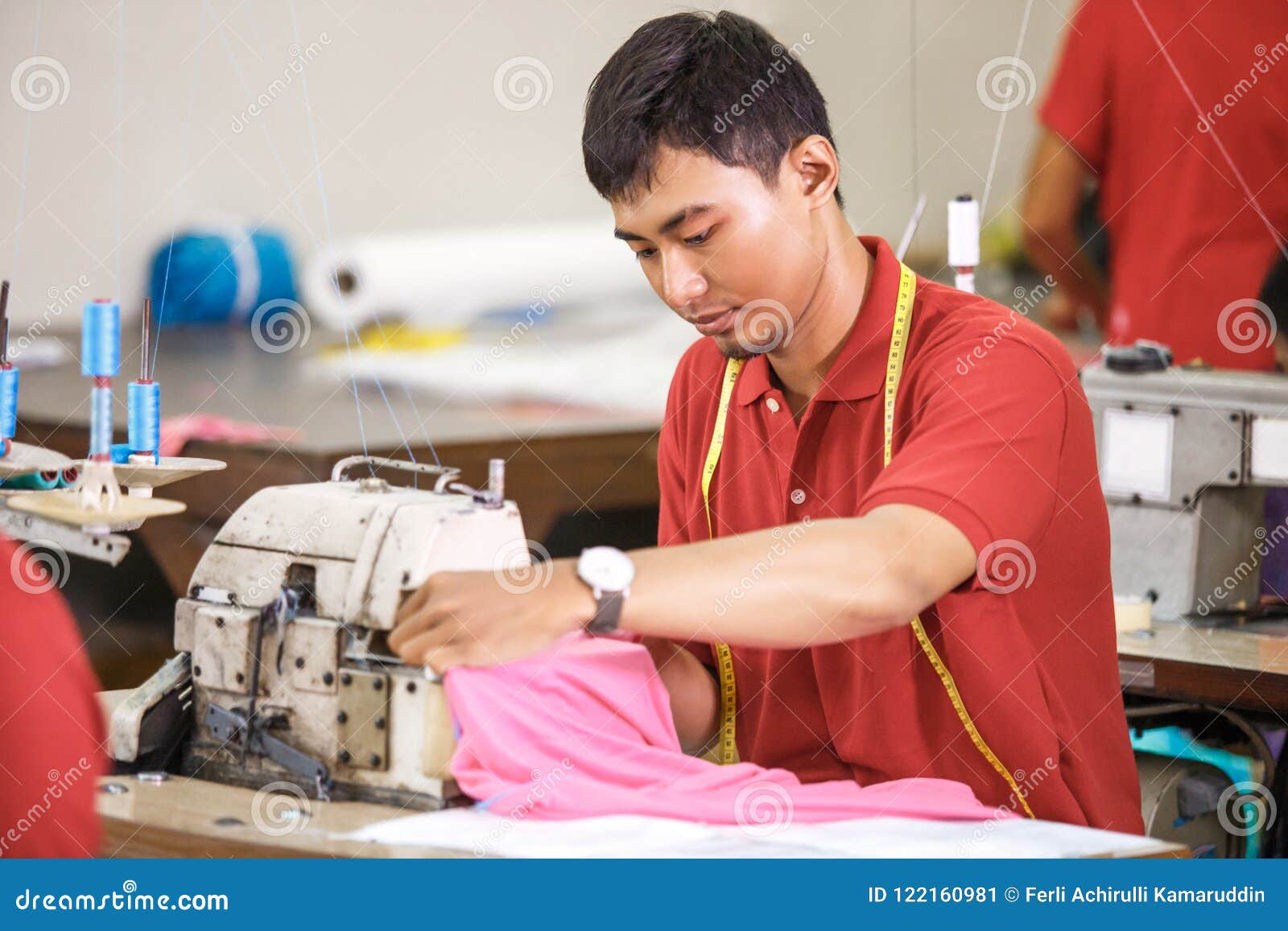 Asian Worker in Textile Factory Sewing Using Industrial Sewing M Stock ...