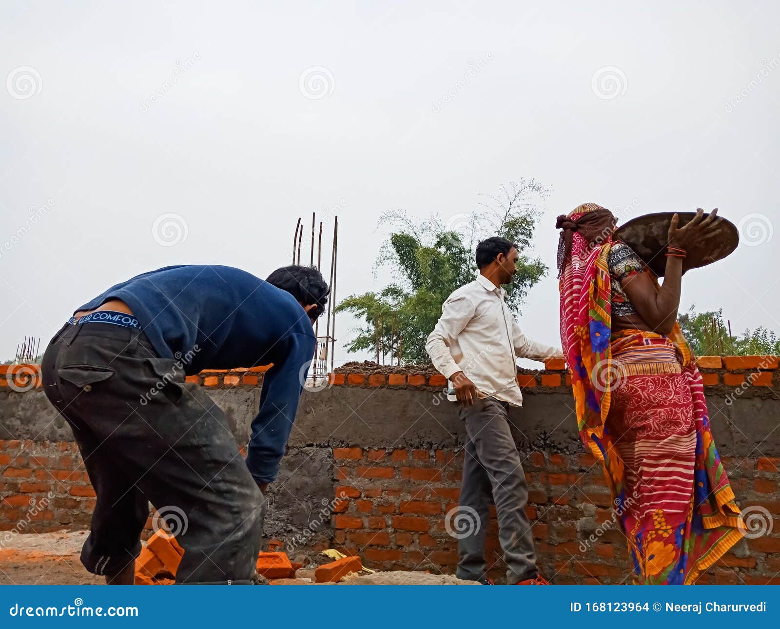 Asian Workers Transporting Building Materials during Home Construction ...