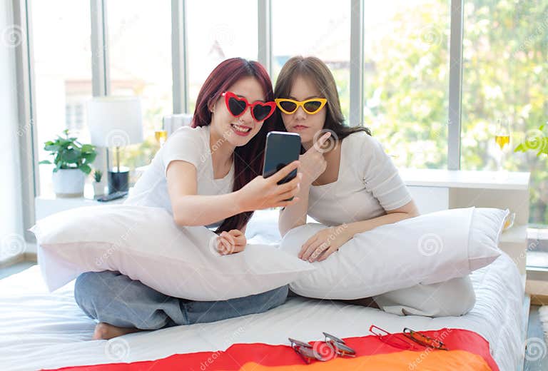 Asian Young Cheerful Female Lgbtq Lesbian Lover Couple Partner Smiling Trying Funny Sunglasses