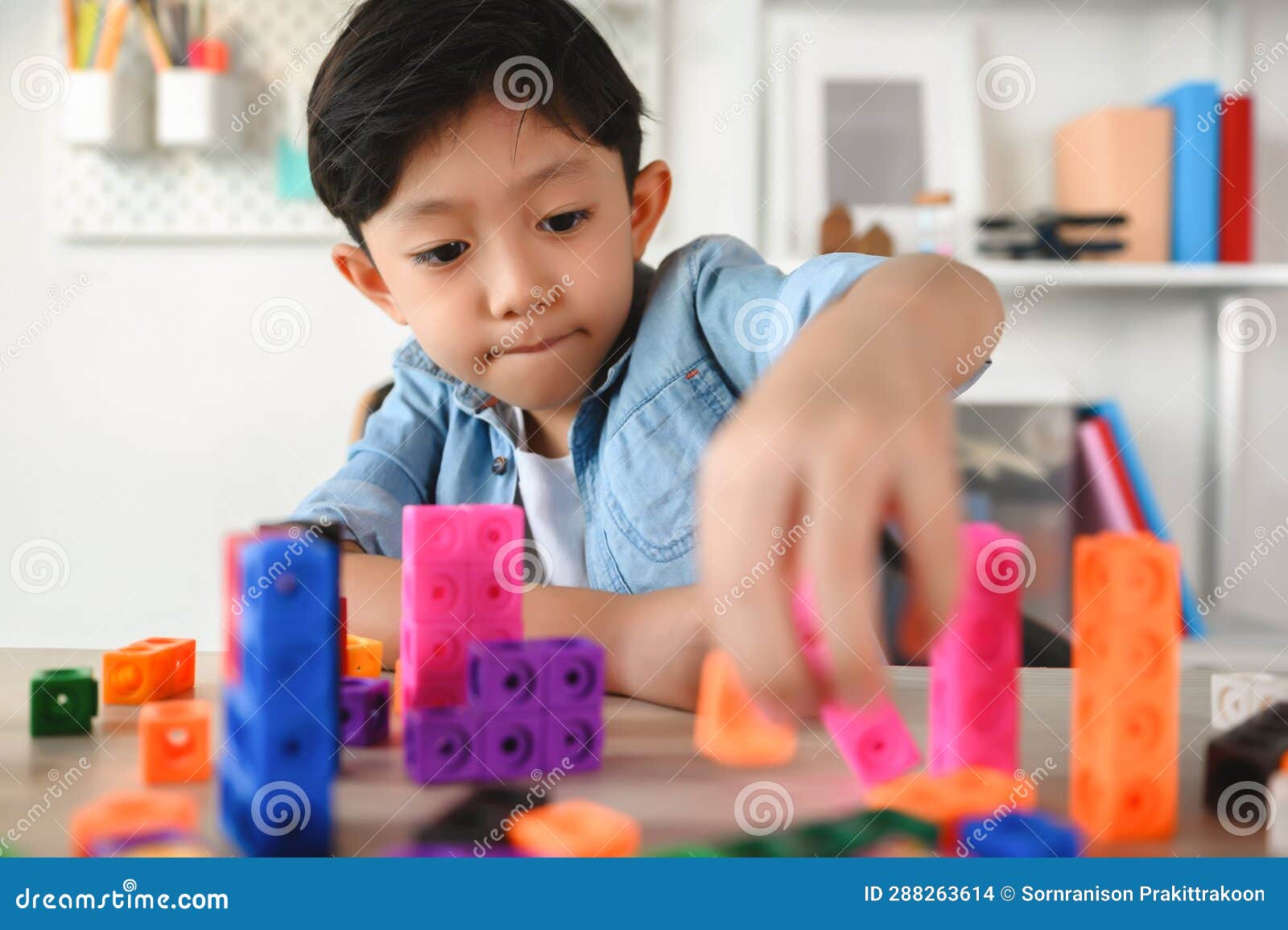 Asian Young Child Playing Colorful Plastic Cubes on Desk at Home ...
