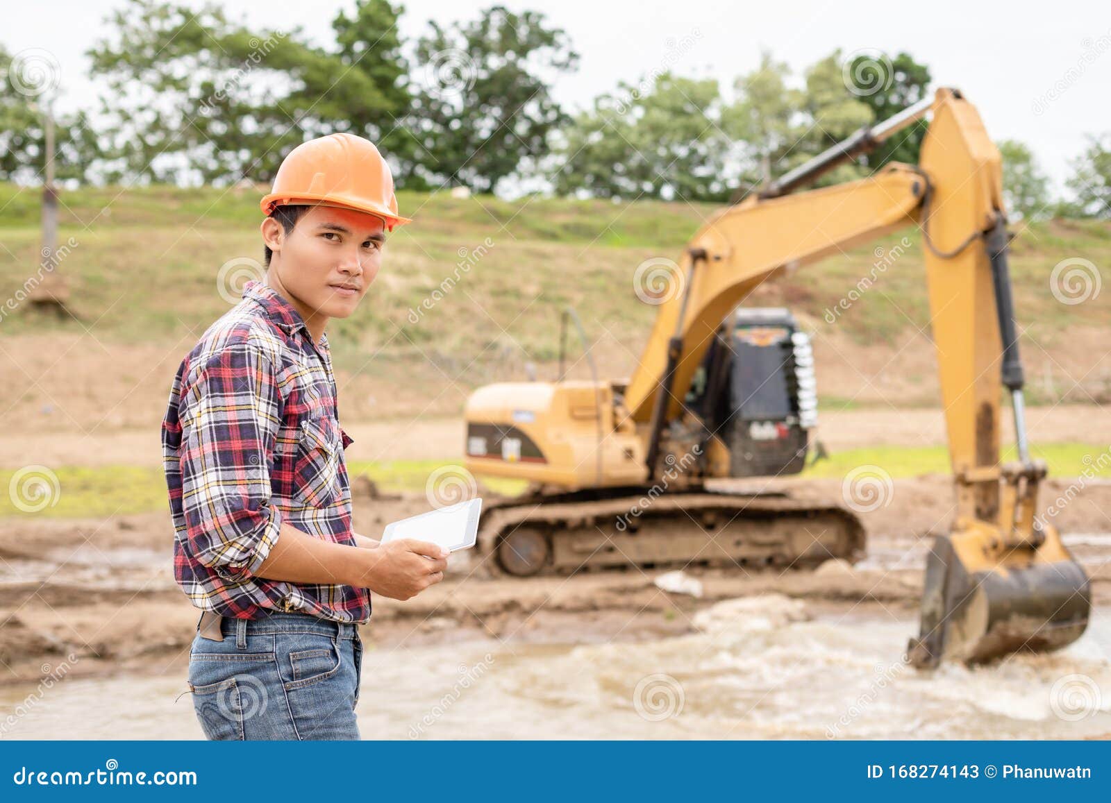 Young Engineer Working on Site at the Dam Stock Image - Image of ... Young Engineer Working on Site at the Dam Stock Image - Image of ...