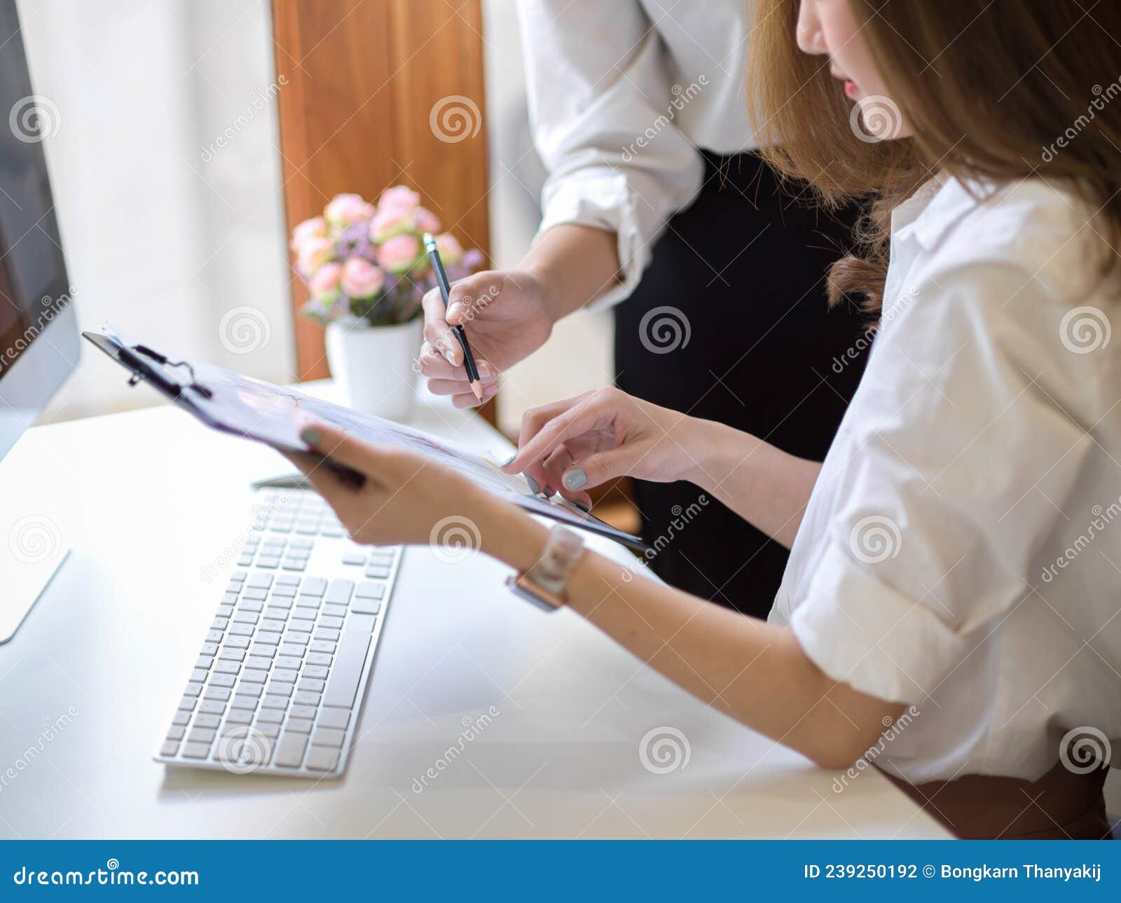Female Trainee and Her Manager Working Together in the Office Stock ...