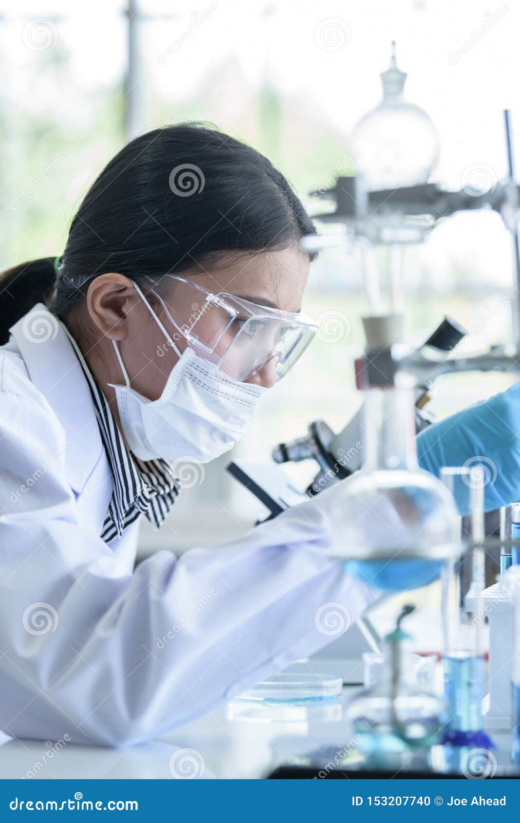 Asian Young Girl Student Scientist Researching and Learning in a ...