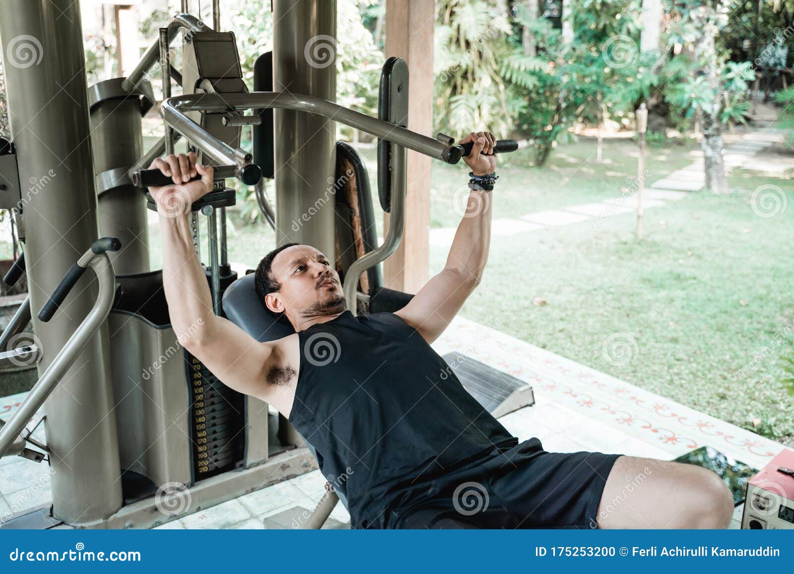Asian Young Man Doing Chest Press Exercise Stock Photo - Image of ...